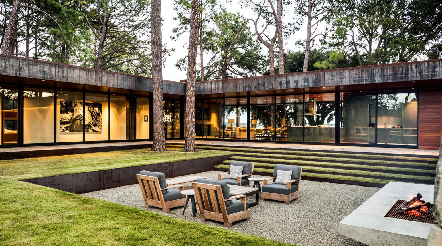 A Contemporary Lakefront Home with Concrete and Weathering Steel in ...