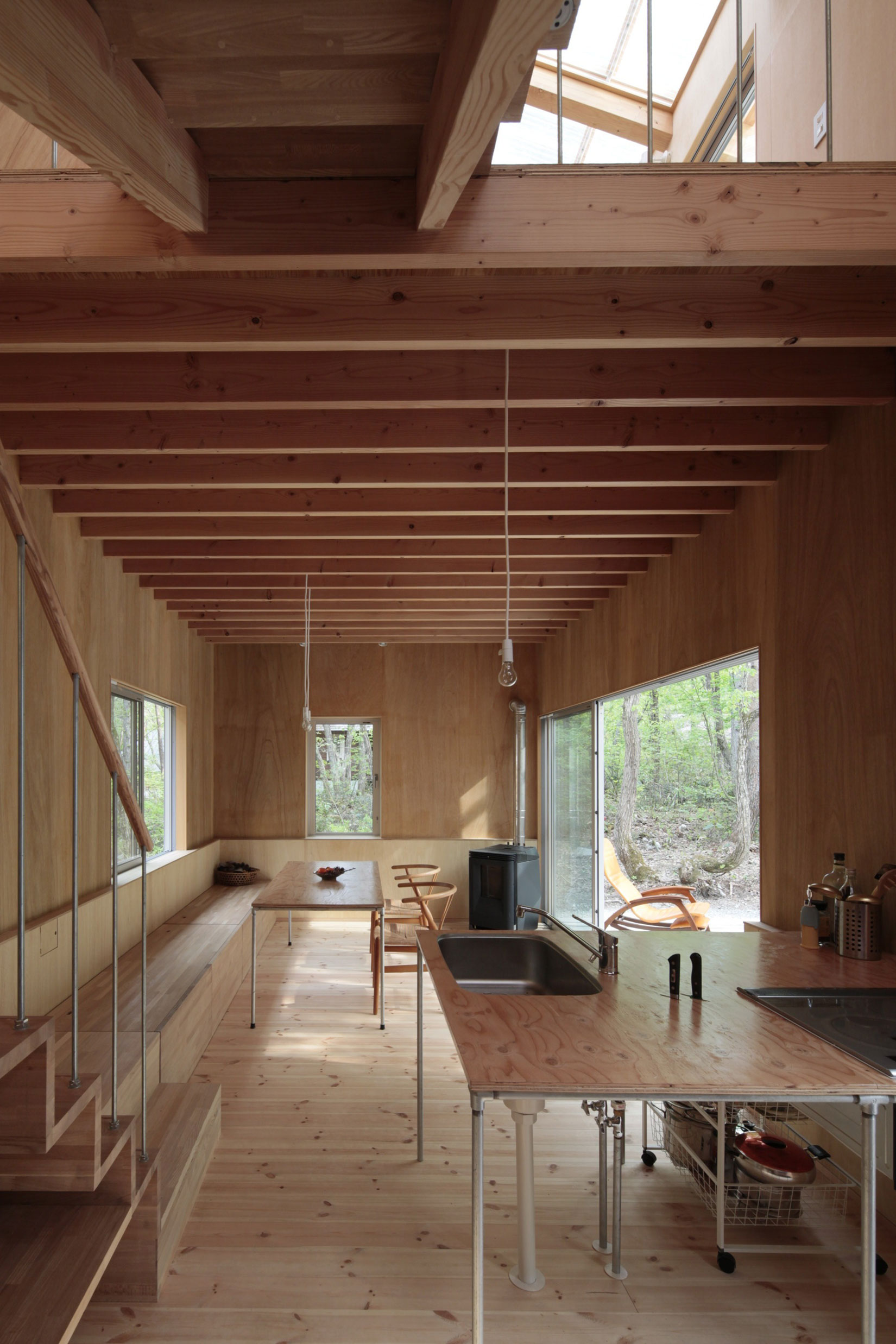 A Dramatic Contemporary Home with an Asymmetric Roof and Overhanging ...