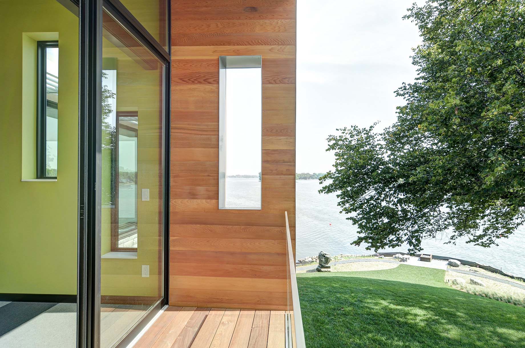 A Stunning Glass Lake House with Modern Silhouette of Earthy Materials ...